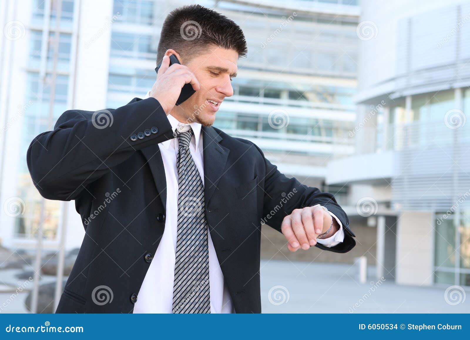 Handsome Business Man Looking at Watch Stock Photo - Image of cell ...