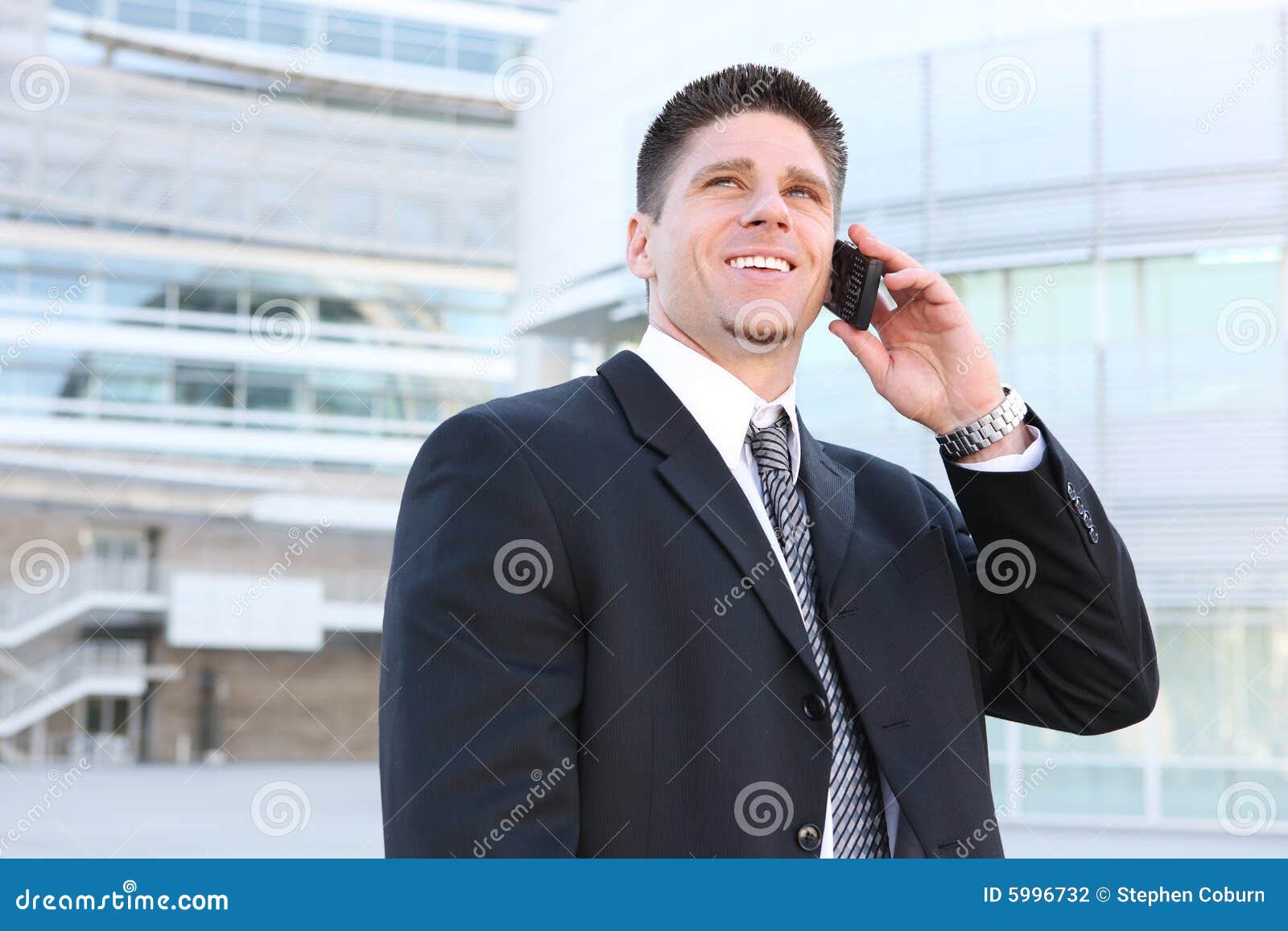 Handsome Business Man at Office on Phone Stock Photo - Image of light ...