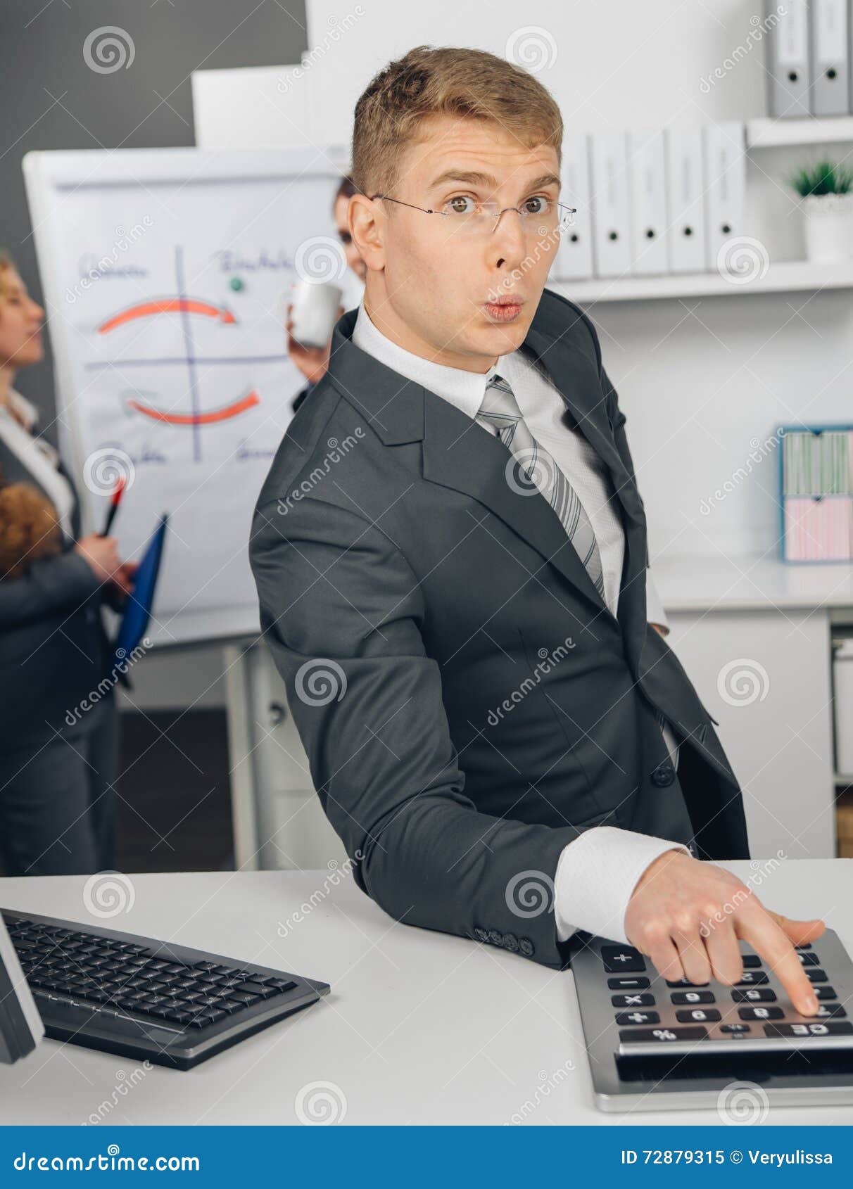 Handsome Businessman Calculating at Calculator Stock Image - Image of ...