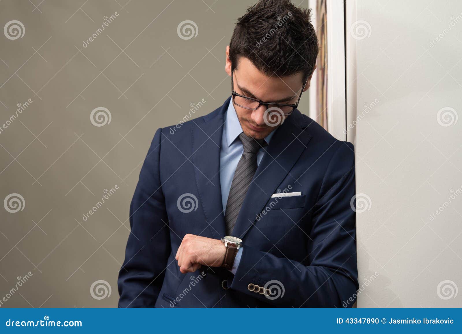 Handsome Businessman Checking Time on His Watch Stock Photo - Image of ...