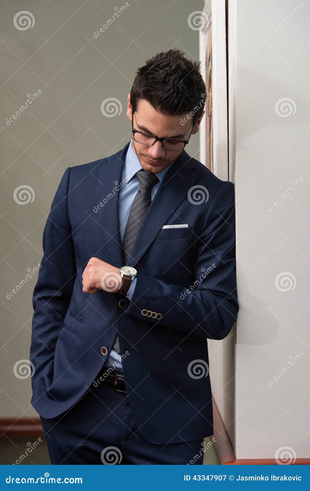 Handsome Businessman Checking Time on His Watch Stock Image - Image of ...