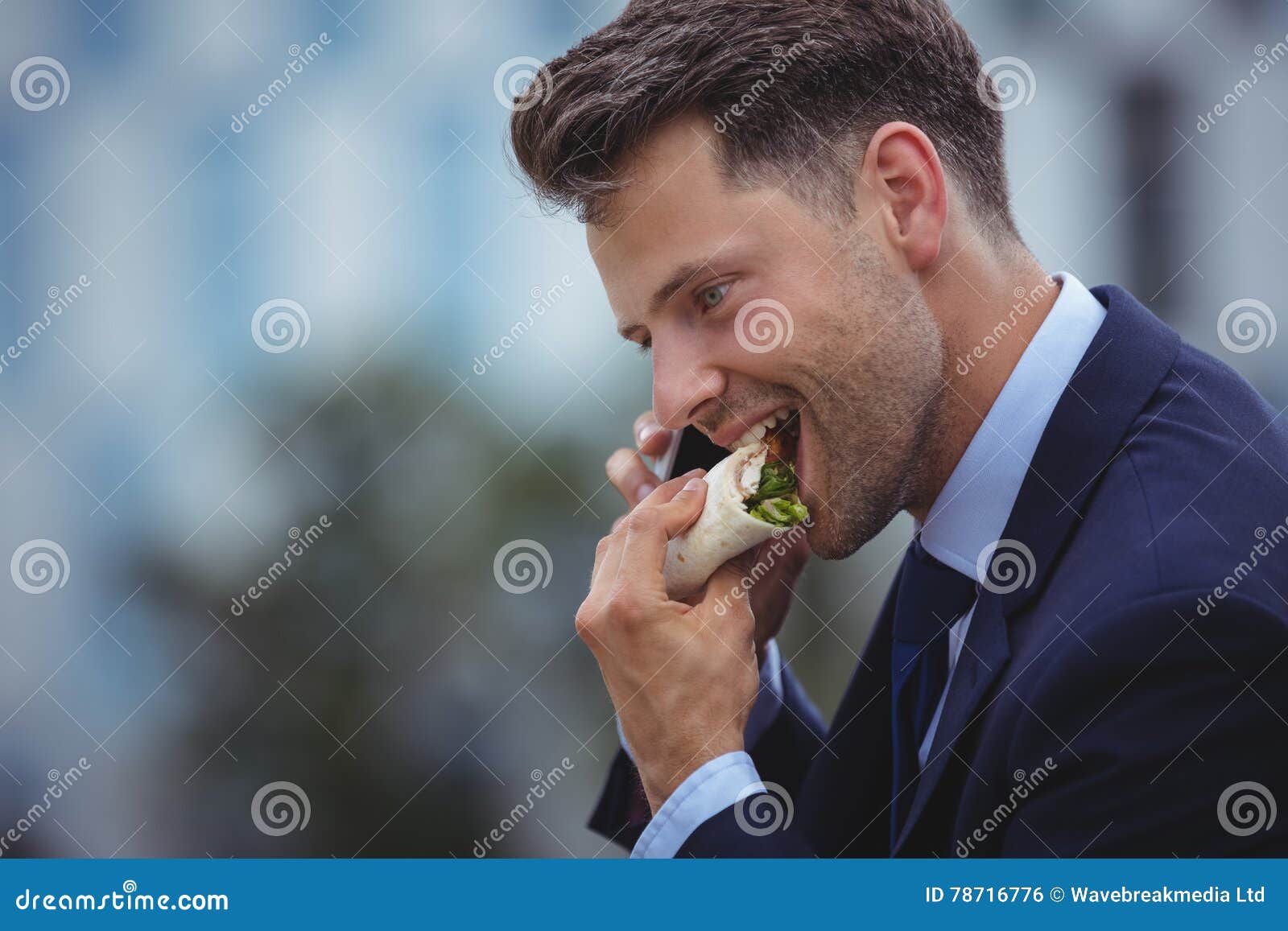 Handsome Businessman Eating Snacks Stock Photo - Image of leisure ...