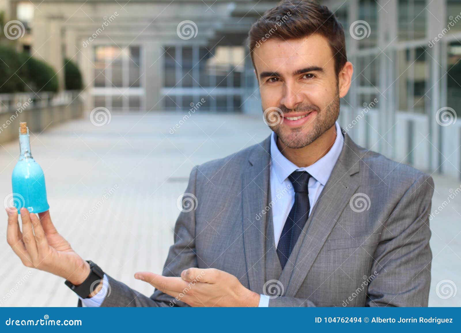 Handsome Businessman Holding a Potion Stock Photo - Image of idea ...