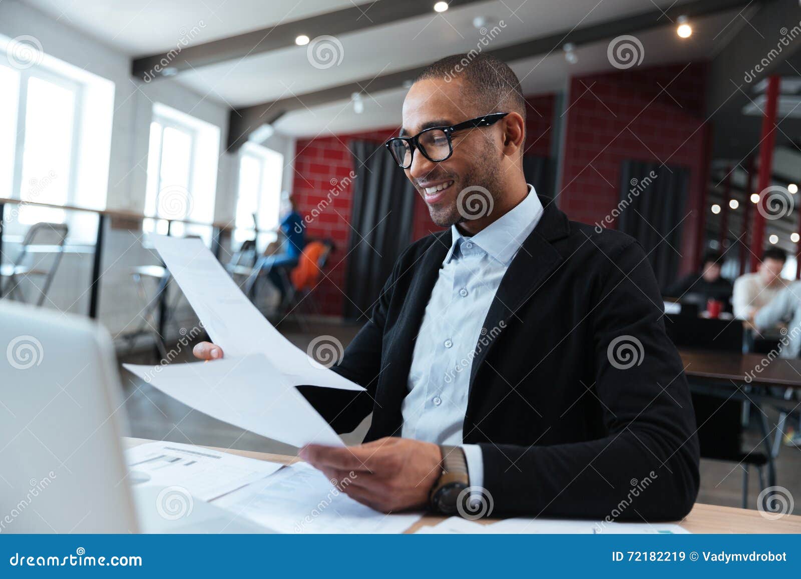 Handsome Businessman Looking at Documents Stock Image - Image of ...