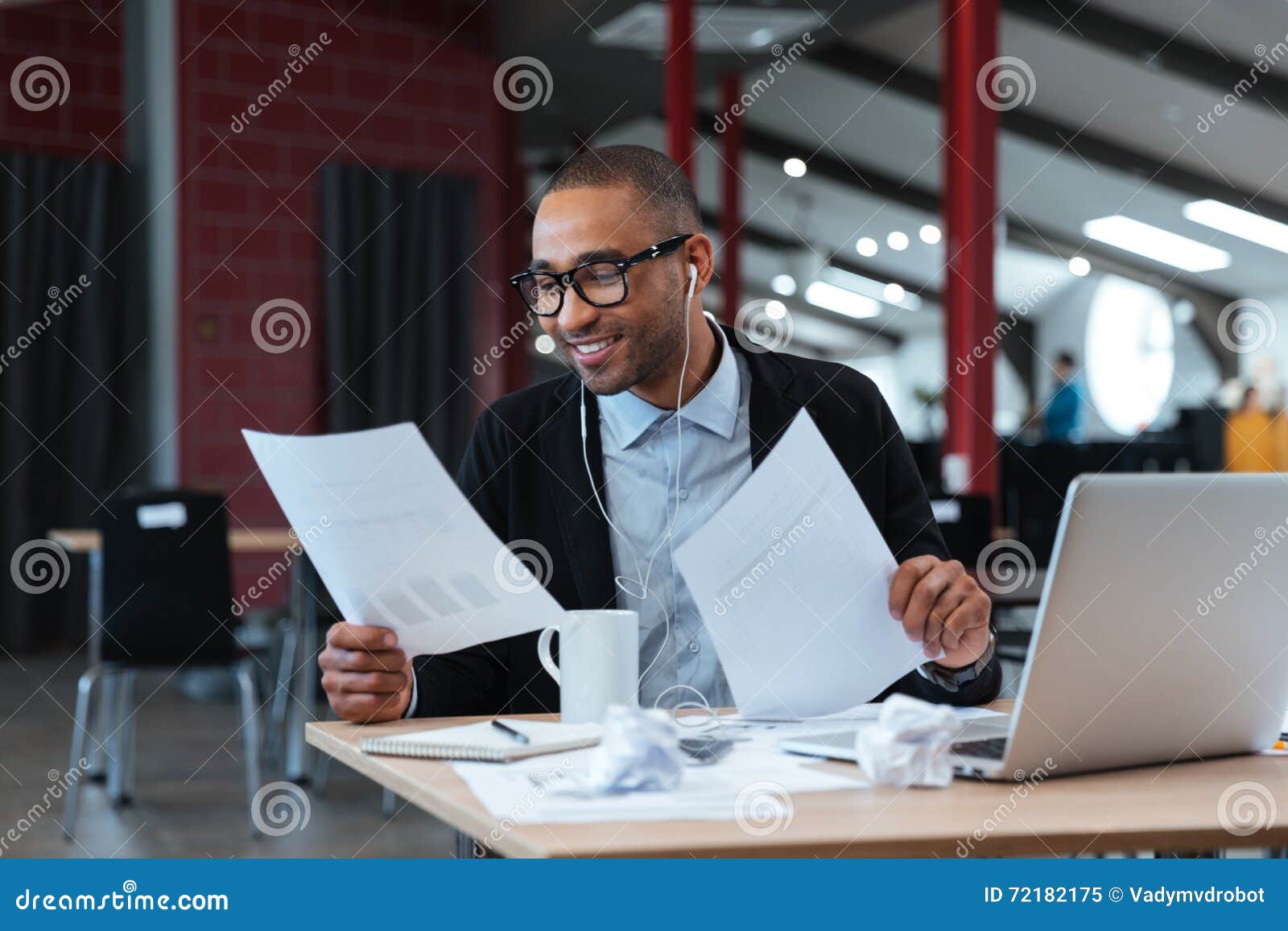 Handsome Businessman Looking at Documents Stock Image - Image of ...