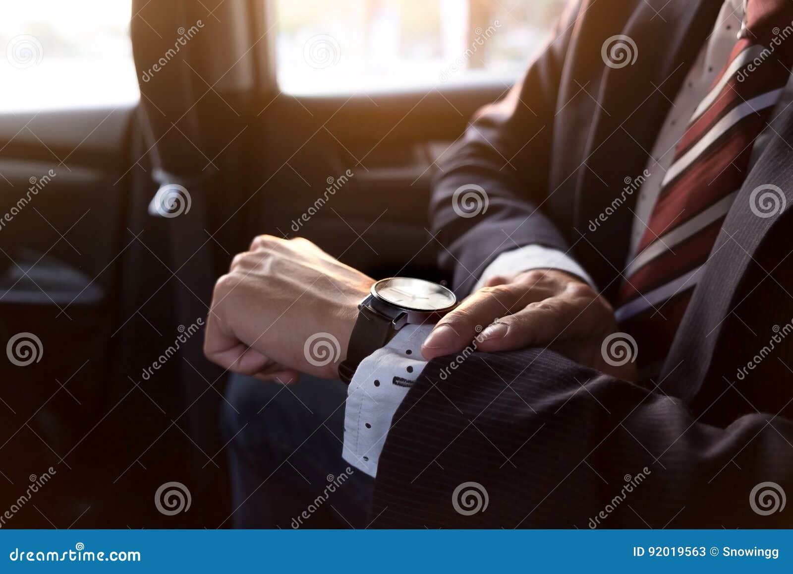 Handsome Businessman Looking on Wrist Watch in Car Stock Image - Image ...