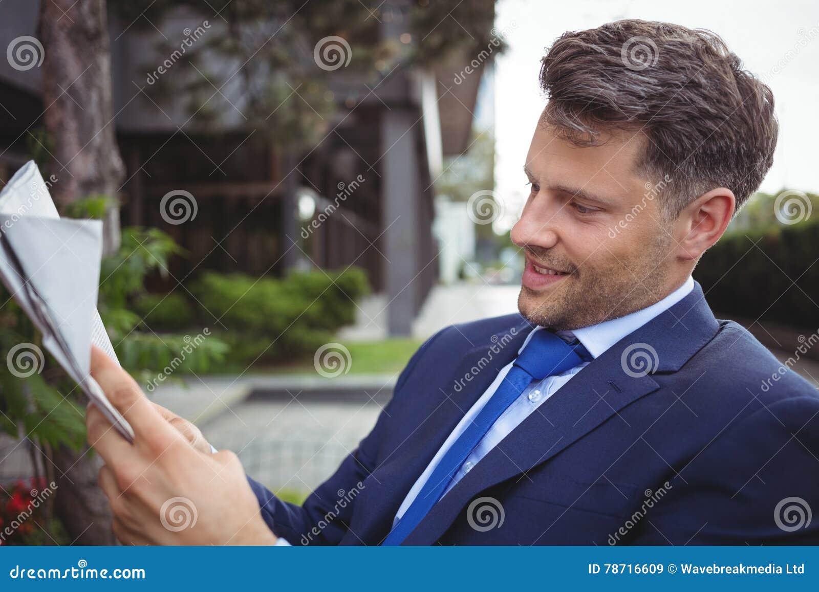 Handsome Businessman Reading Newspaper Stock Image - Image of executive ...