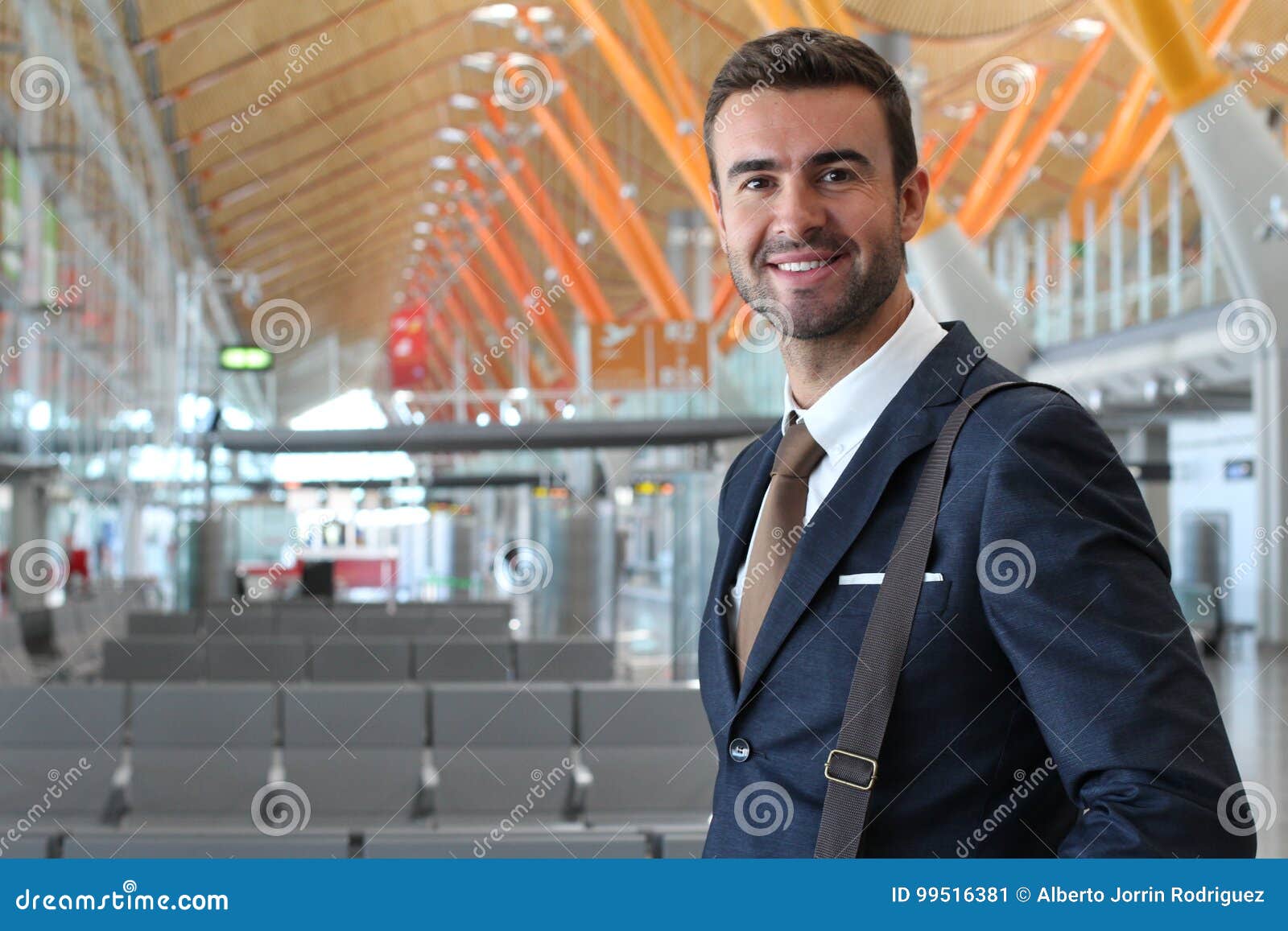 Handsome Businessman Smiling at the Airport with Space for Copy Stock ...