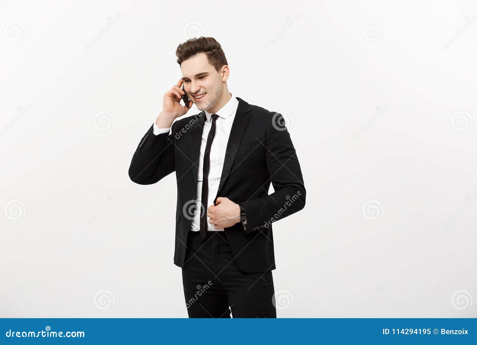 Handsome Businessman in Suit Speaking on the Phone Over Isolated White ... Handsome Businessman in Suit Speaking on the Phone Over Isolated White ...