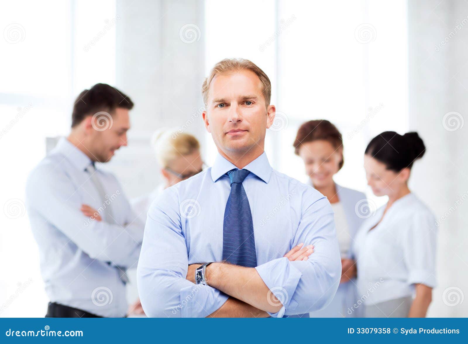 Handsome Businessman with Team in Office Stock Photo - Image of ...