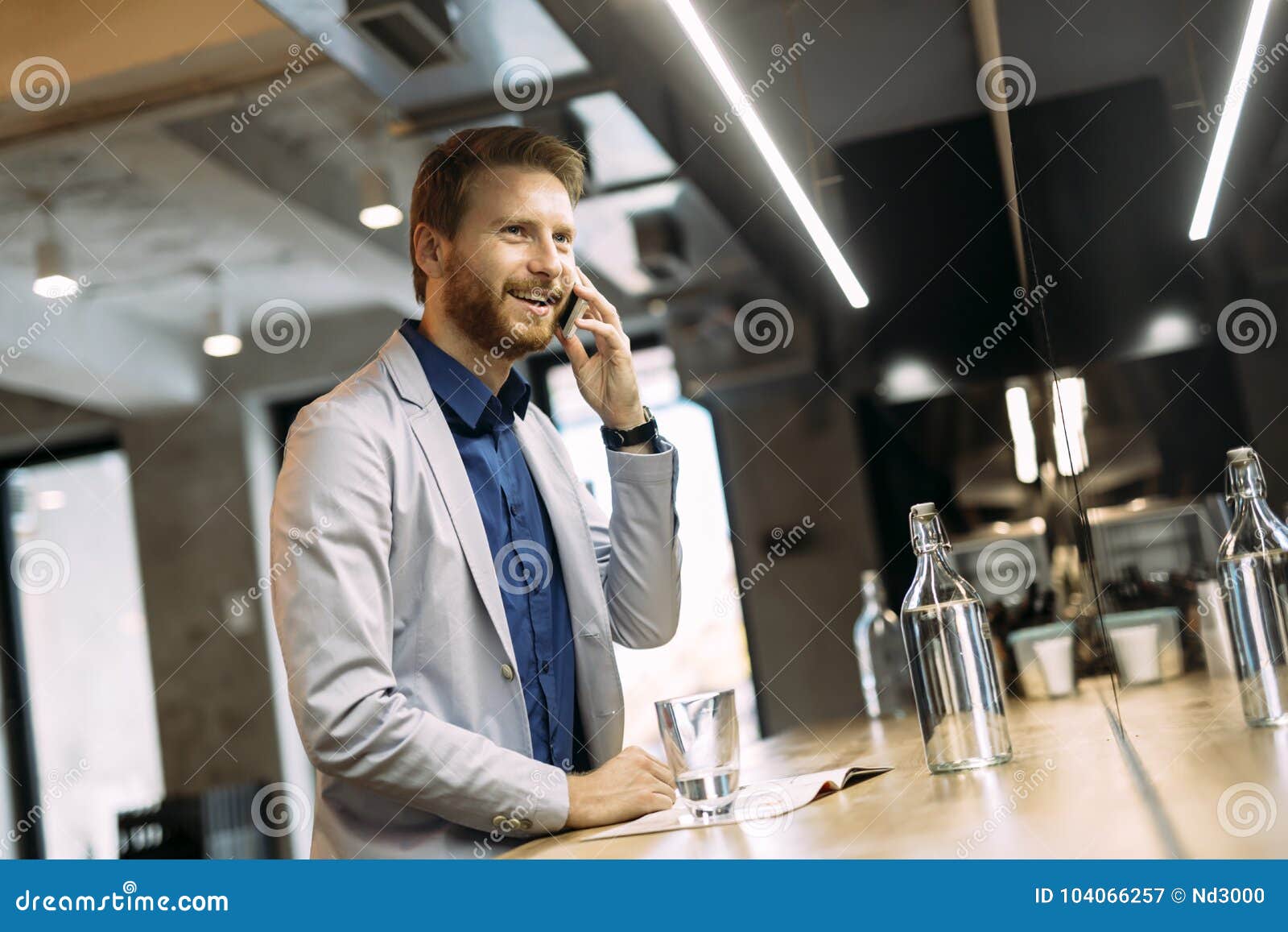 Handsome Businessman Using Smartphone in Pub Stock Image - Image of ...