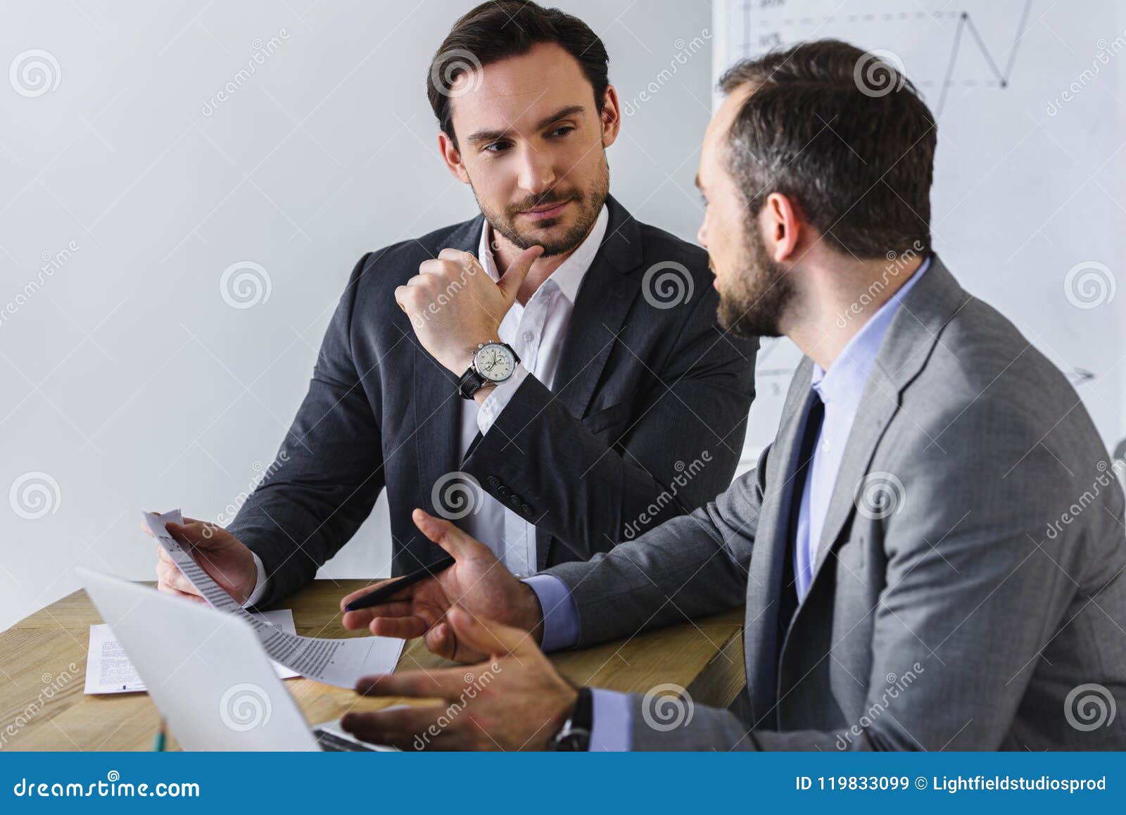 Handsome Businessmen Talking at Table Stock Image - Image of selective ...
