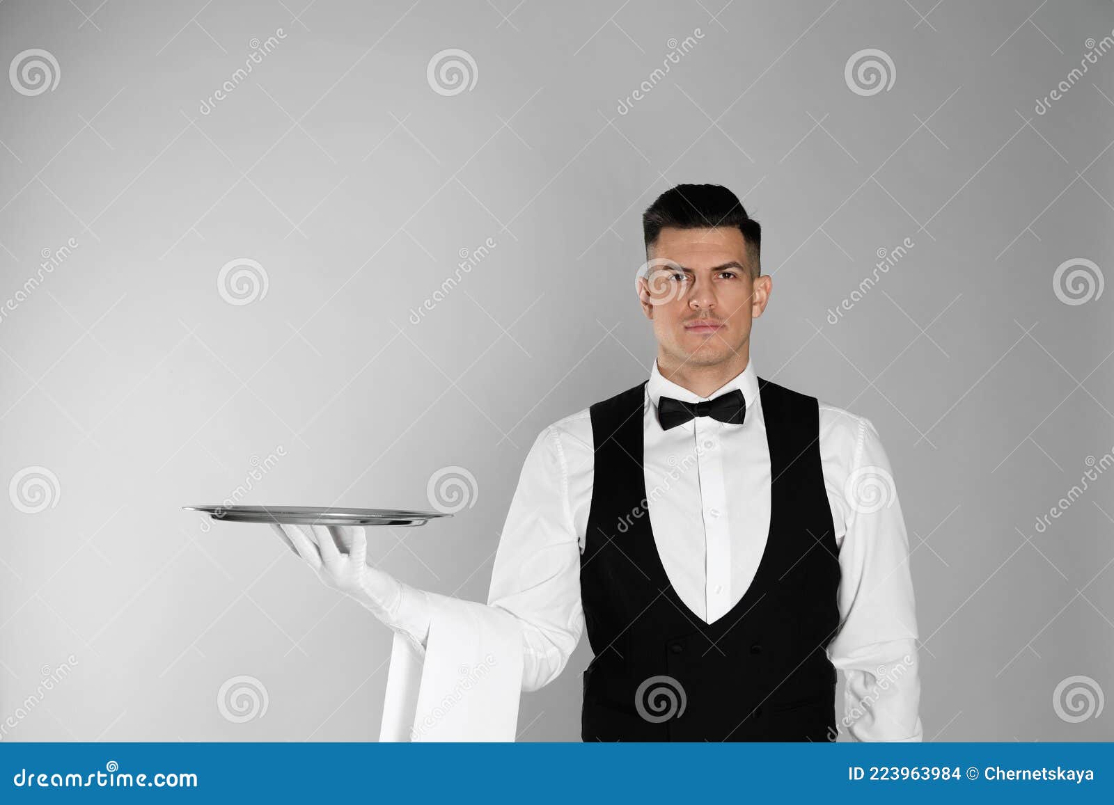 Handsome Butler With Tray On Light Grey Background Royalty-Free Stock ...