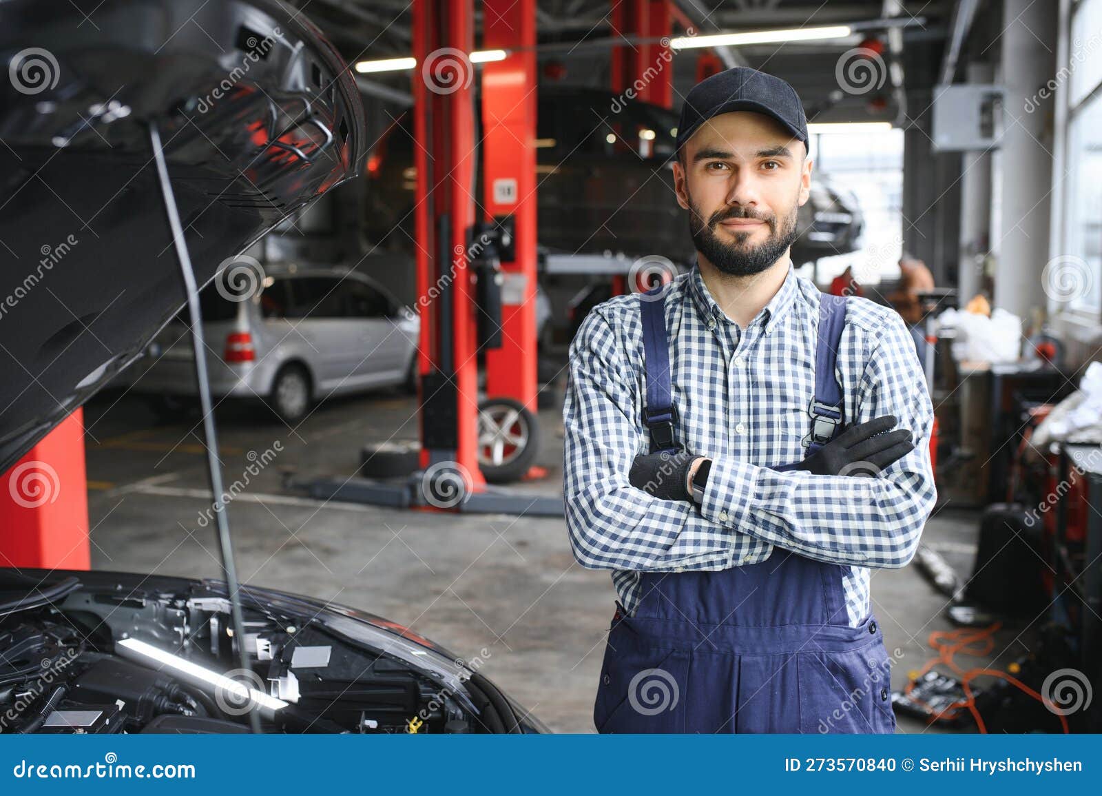 Handsome Car Mechanic is Posing in a Car Service. Stock Photo - Image ...