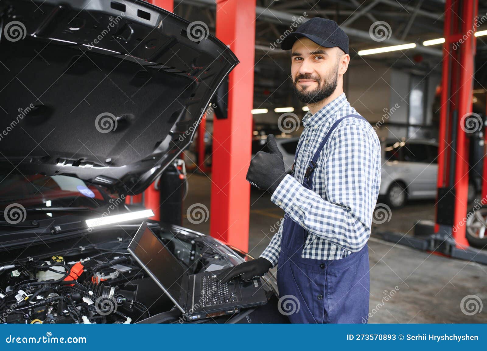 Handsome Car Mechanic is Posing in a Car Service. Stock Image - Image ...