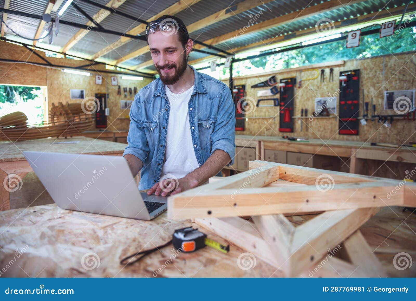 Handsome carpenter working stock image. Image of design - 287769981