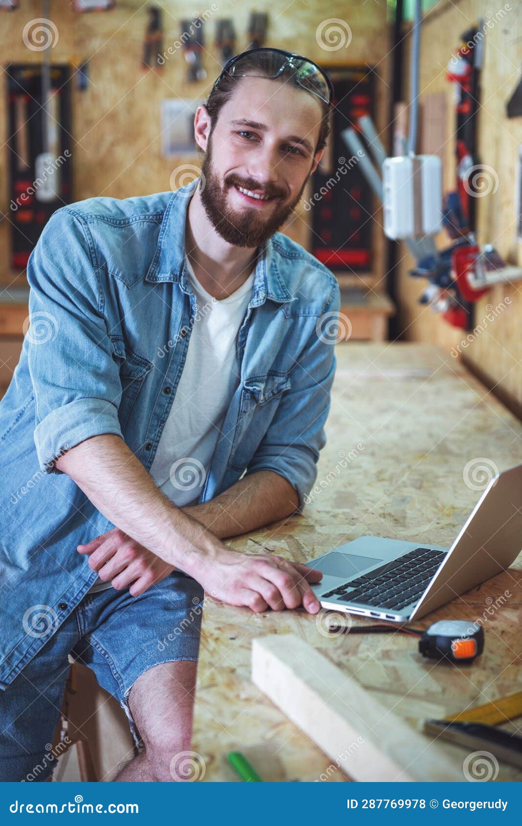 Handsome carpenter working stock photo. Image of examine - 287769978