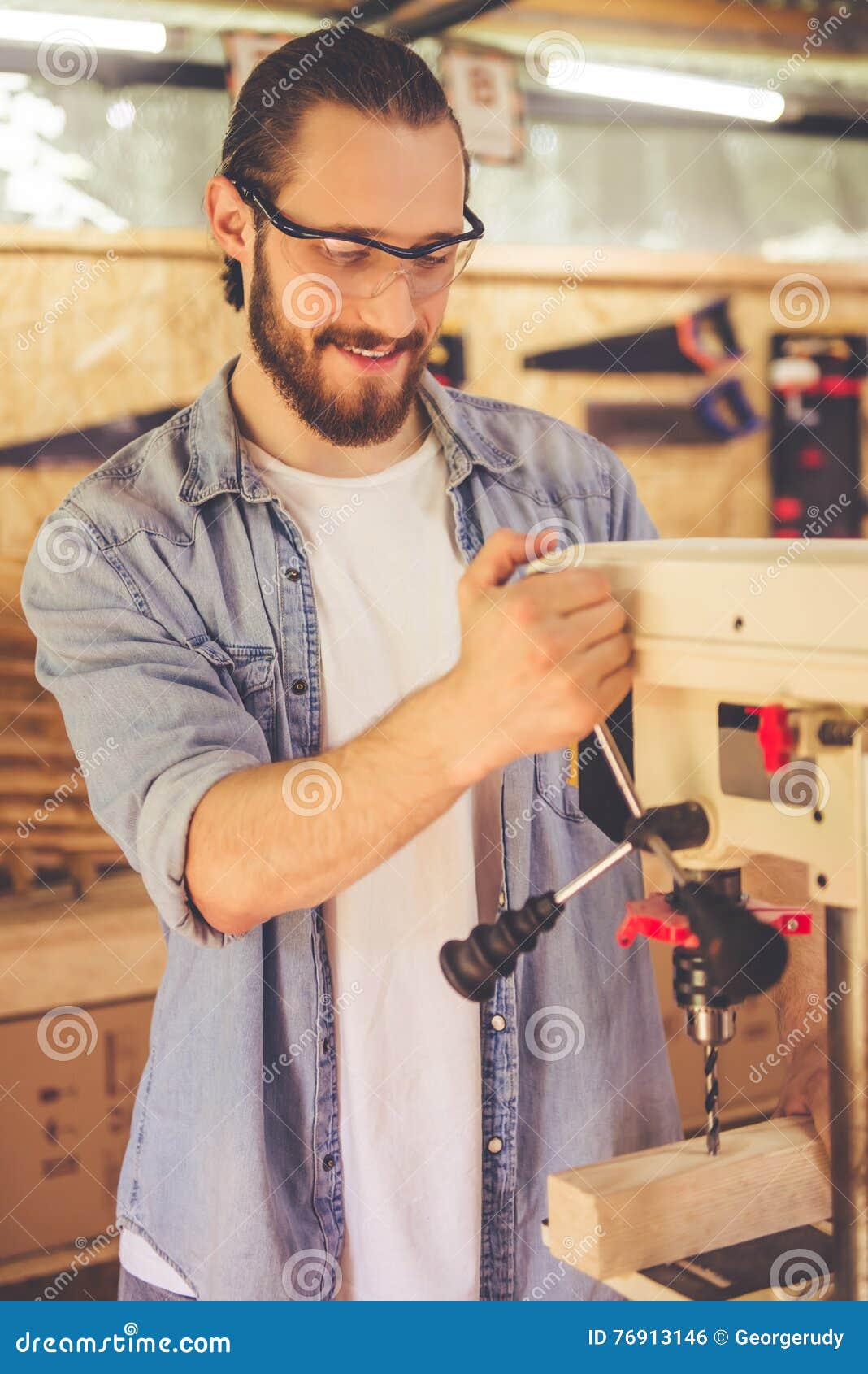 Handsome carpenter working stock photo. Image of drill - 76913146
