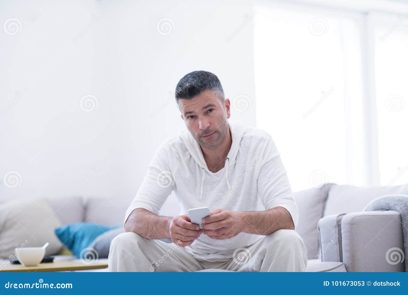 Young Man Using a Mobile Phone at Home Stock Image - Image of adult ...