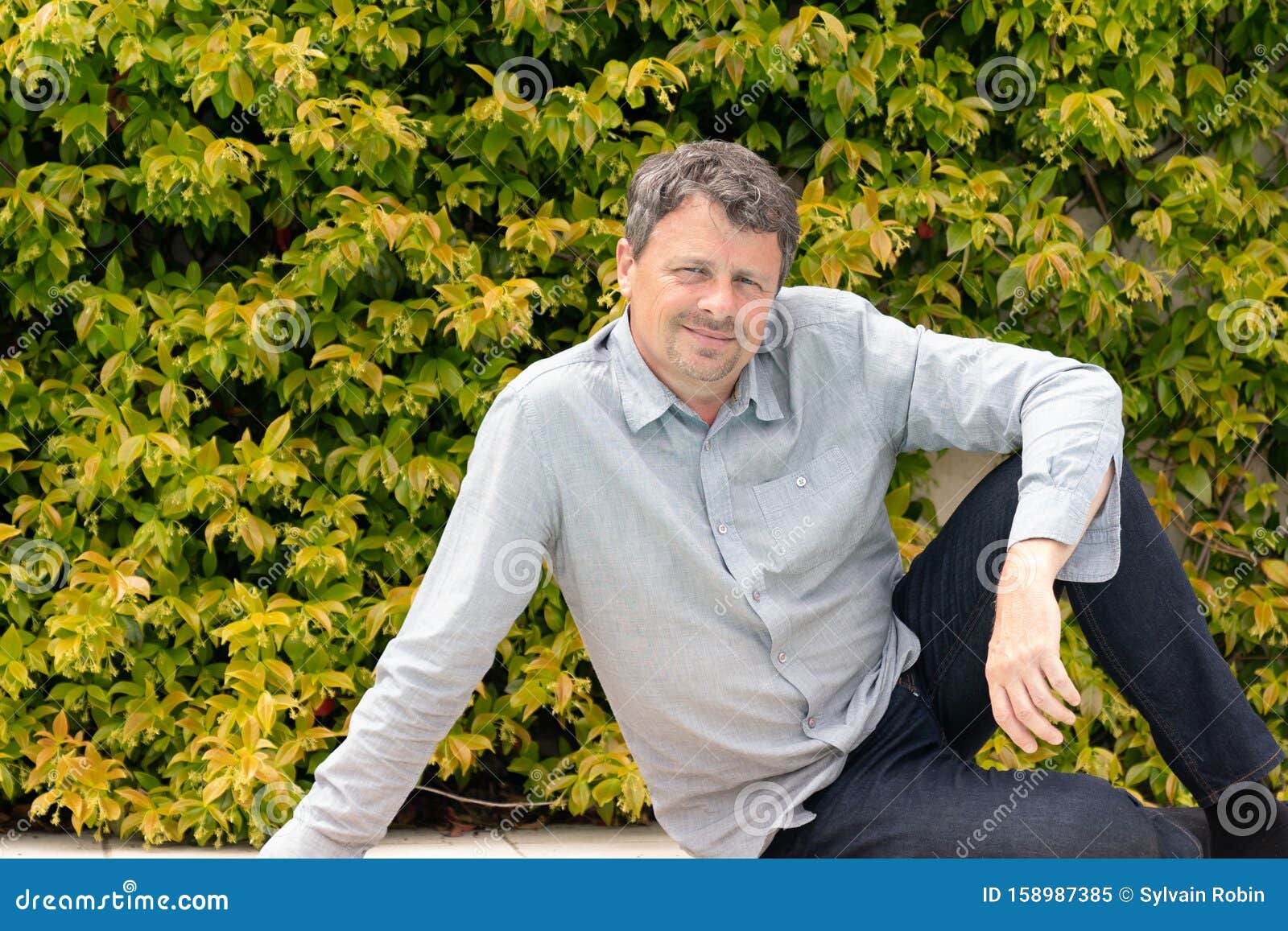 Handsome Caucasian Bearded Man Sitting Outdoor In Home House Garden