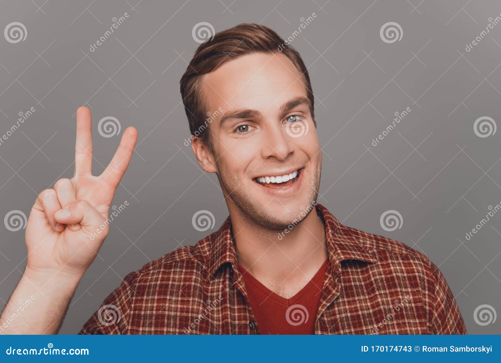 Handsome Cheerful Man Gesturing with Two Fingers Stock Image - Image of ...