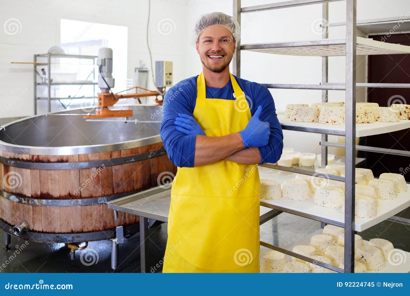 Handsome Cheesemaker Making Curd Cheese in His Factory. Stock Image ...