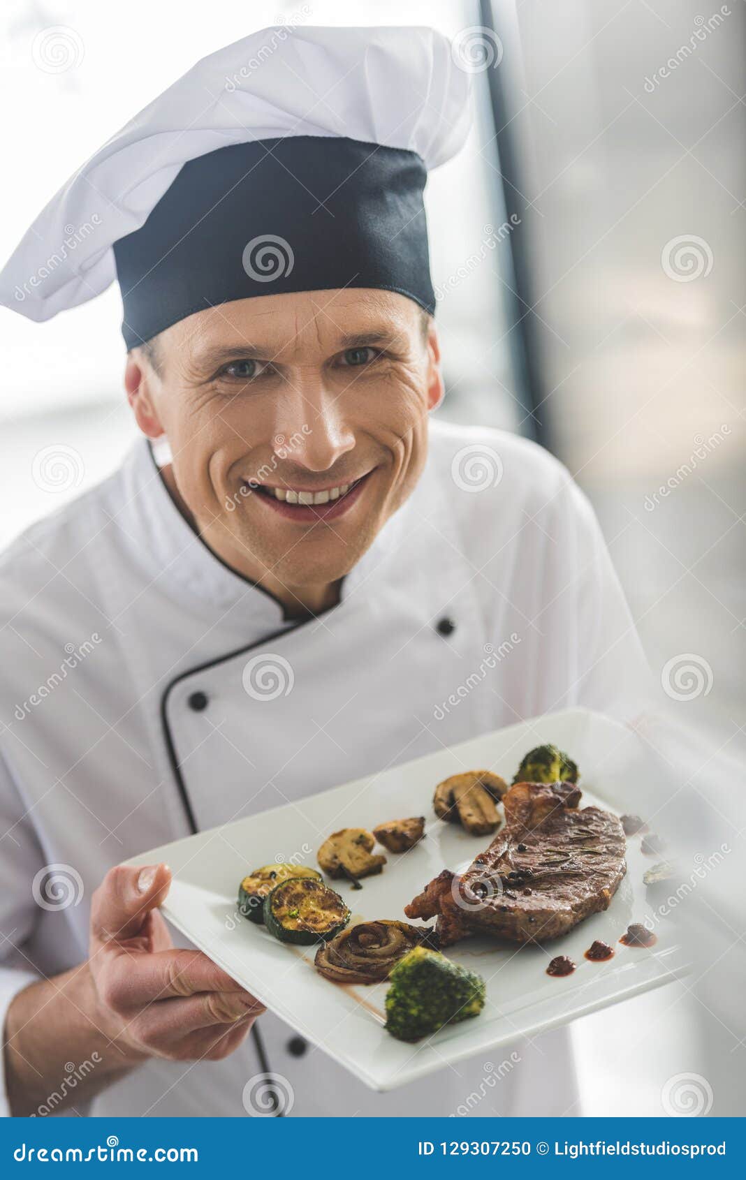 Handsome Chef Holding Plate with Cooked Steak Stock Photo - Image of ...