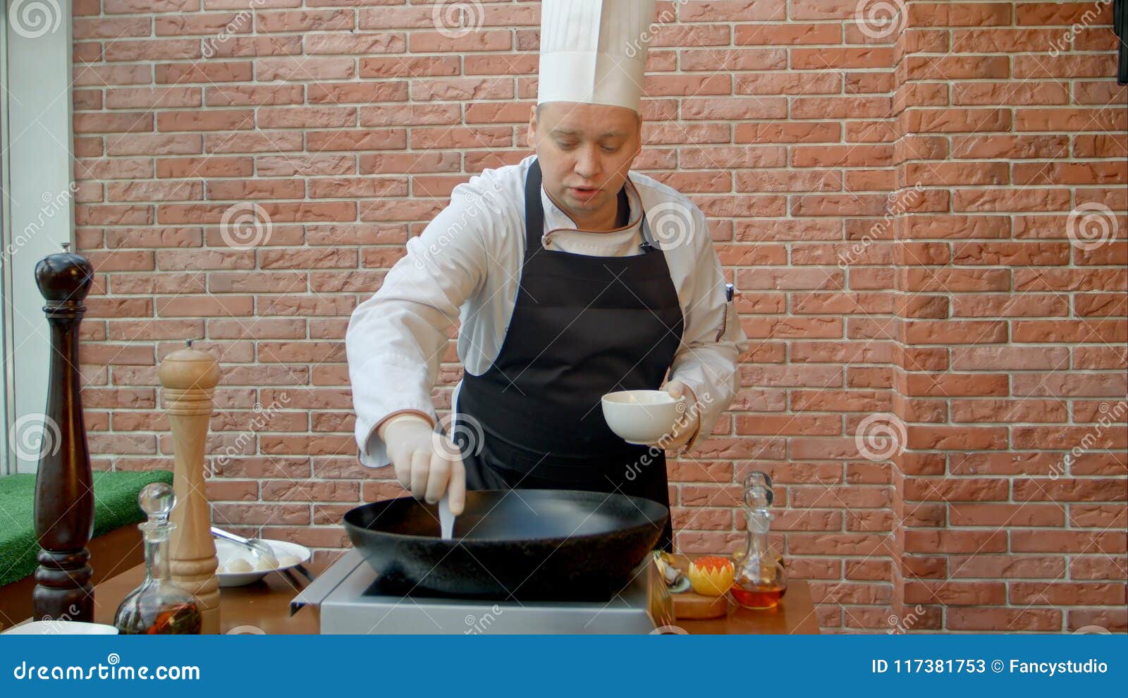 Handsome Chef Preparing Pan with Batter and Talking To Camera Stock ...