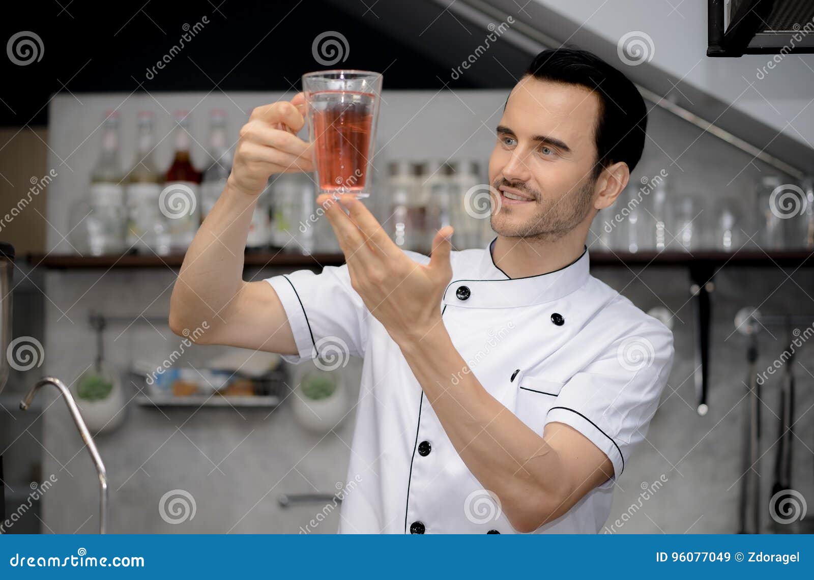 Handsome Chef in Uniform Lifting a Glass of Water. Stock Image - Image ...