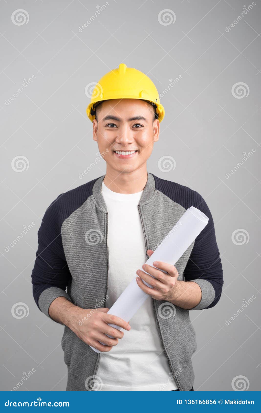 Handsome Civil Engineer Working with Documents on Gray Background Stock ...