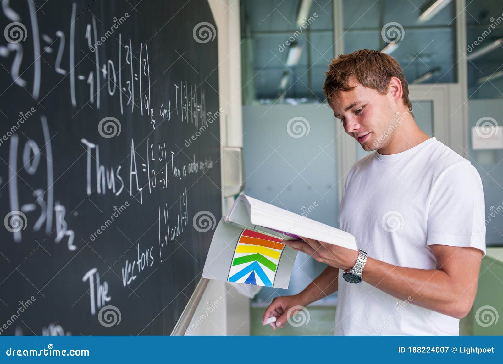 Handsome College Student Solving a Math Problem during Math Class Stock ...