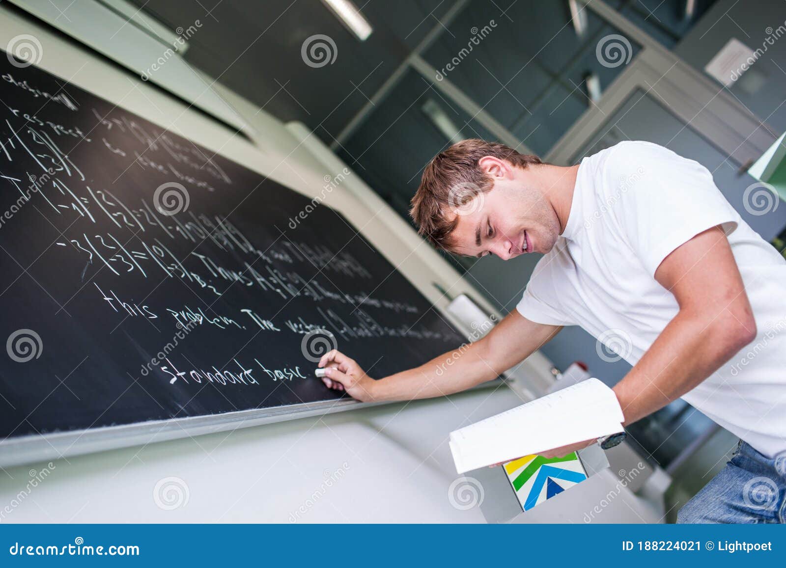 Handsome College Student Solving a Math Problem during Math Class Stock ...