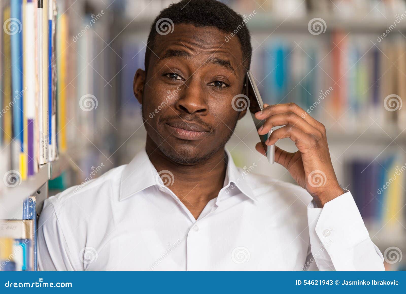 Handsome College Student Using Mobile Phone in Library Stock Image ...