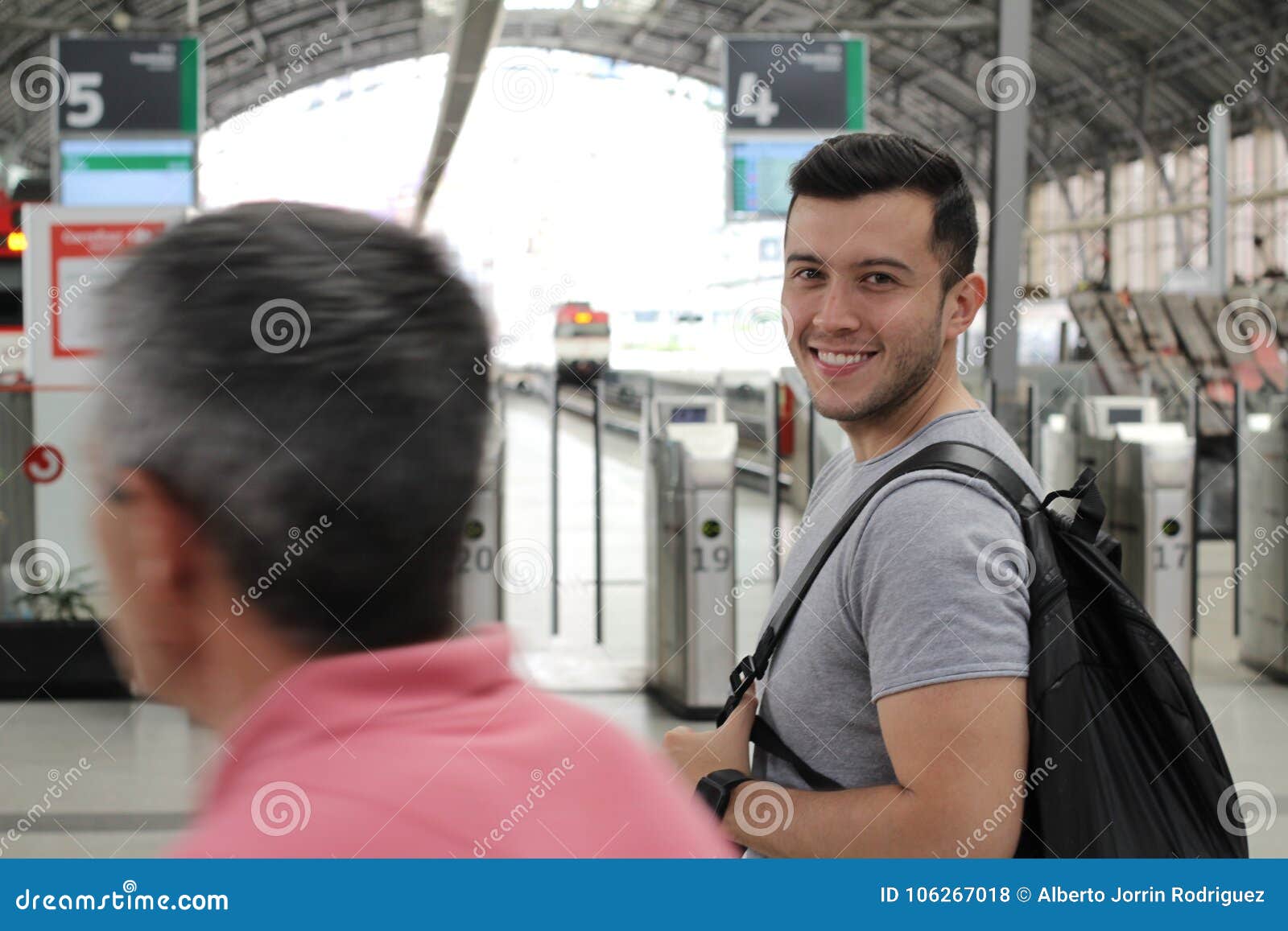 Handsome Commuter Smiling while Waiting for His Train Stock Photo ...