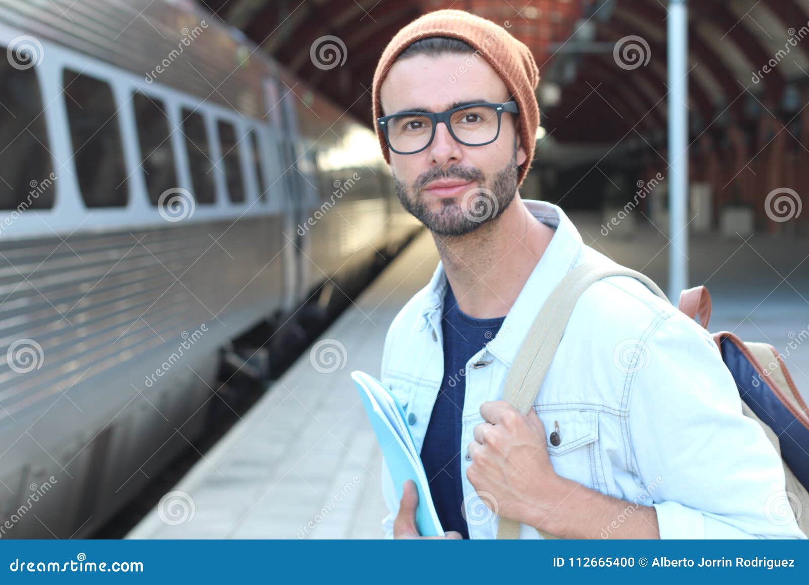 Handsome Commuter Smiling while Waiting for His Train Stock Photo ...