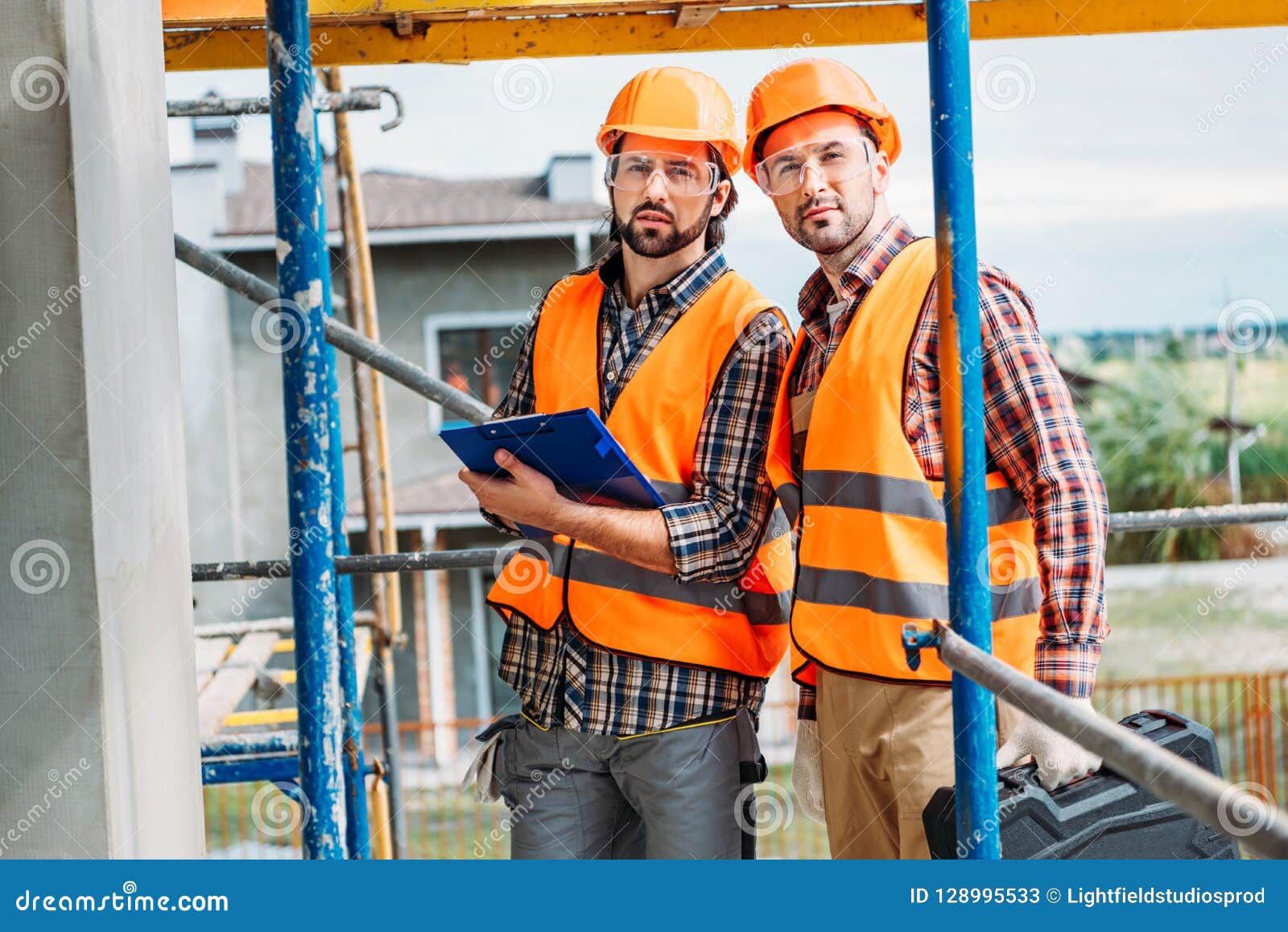 Handsome Confident Builders with Clipboard Standing Stock Image - Image ...