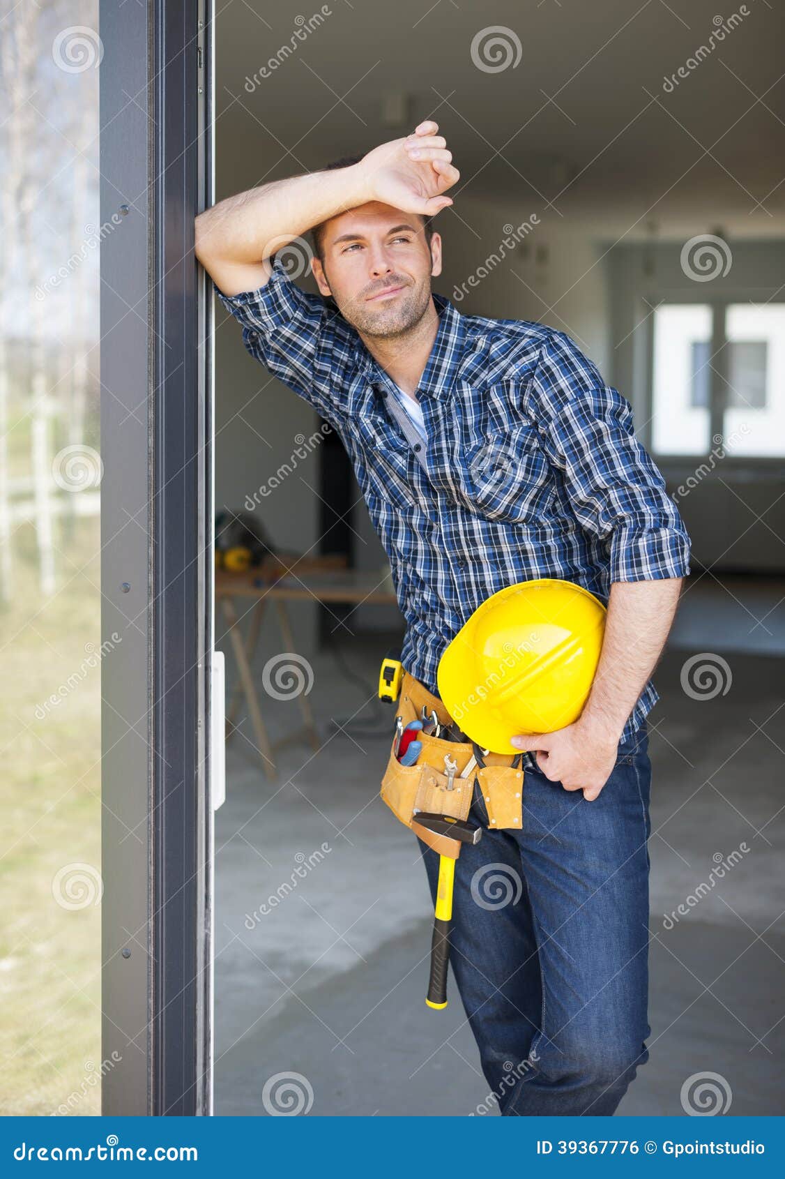 Handsome Construction Worker Stock Photo - Image of leaning, home: 39367776