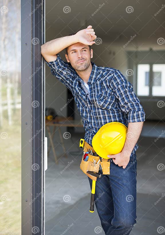 Handsome Construction Worker Stock Photo - Image of leaning, home: 39367776
