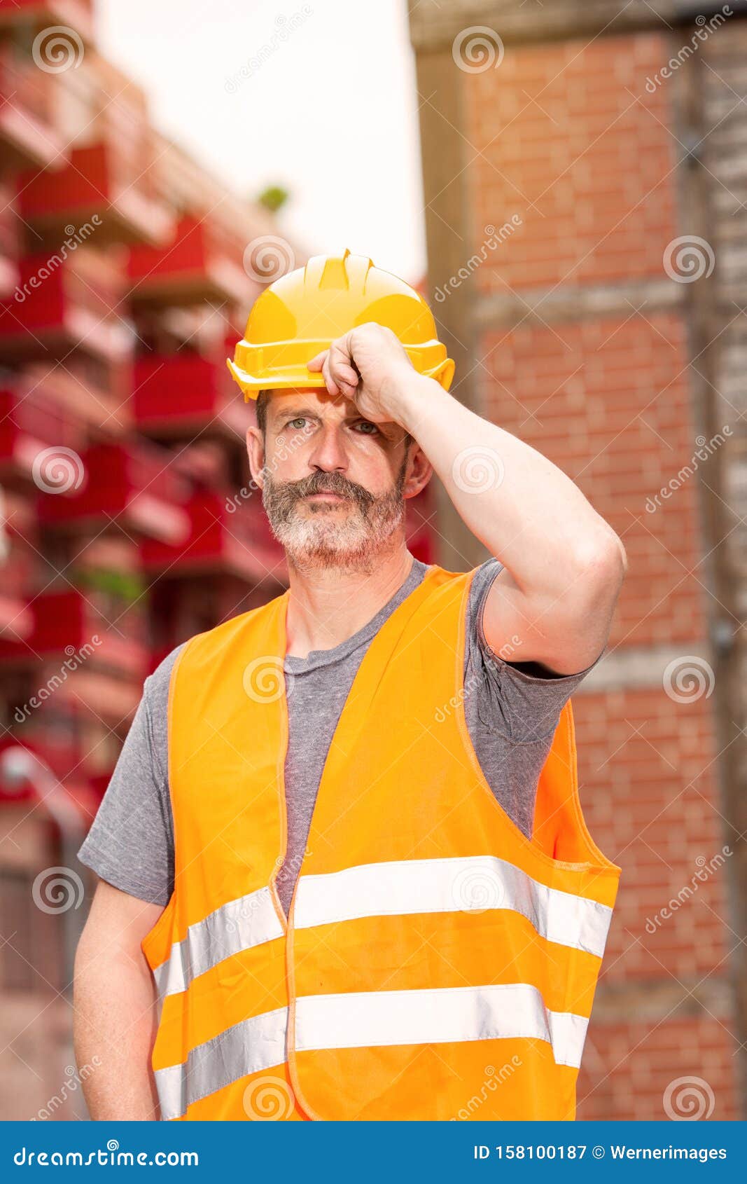 Handsome Construction Worker with Yellow Helmet at Construction Site ...