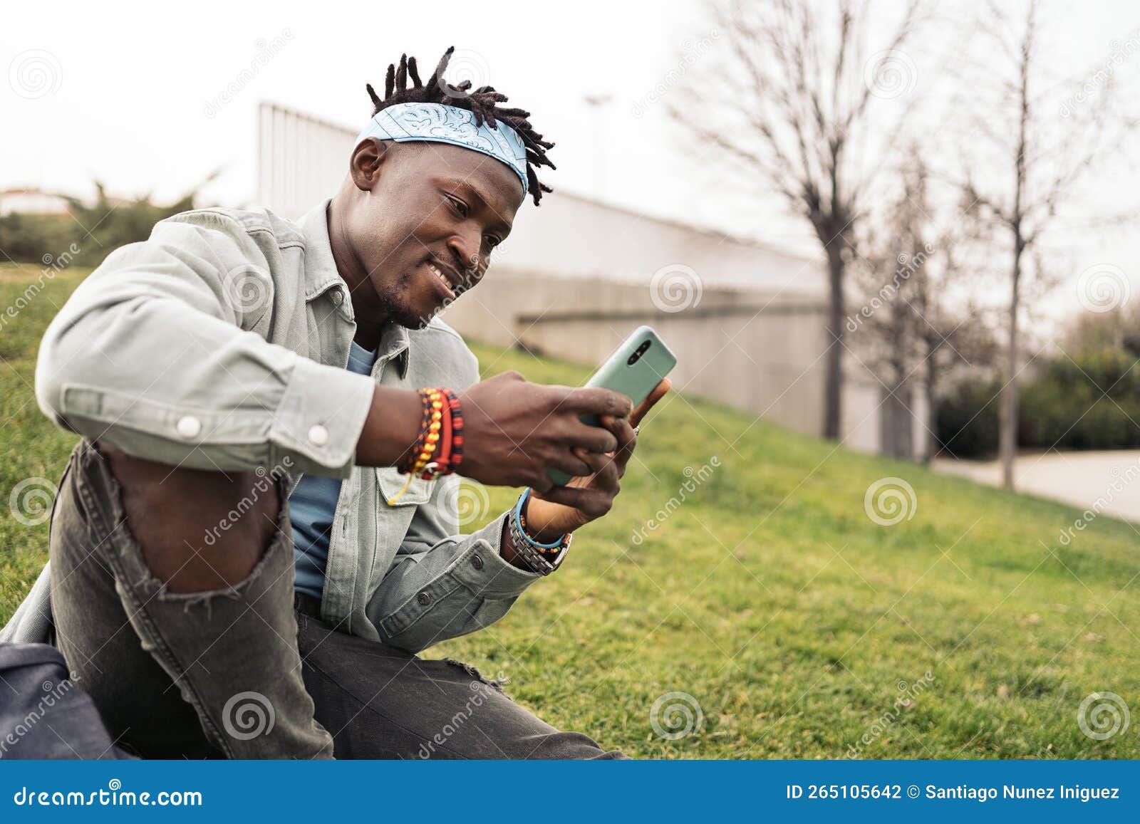 Black Boy Using Phone stock photo. Image of american - 265105642