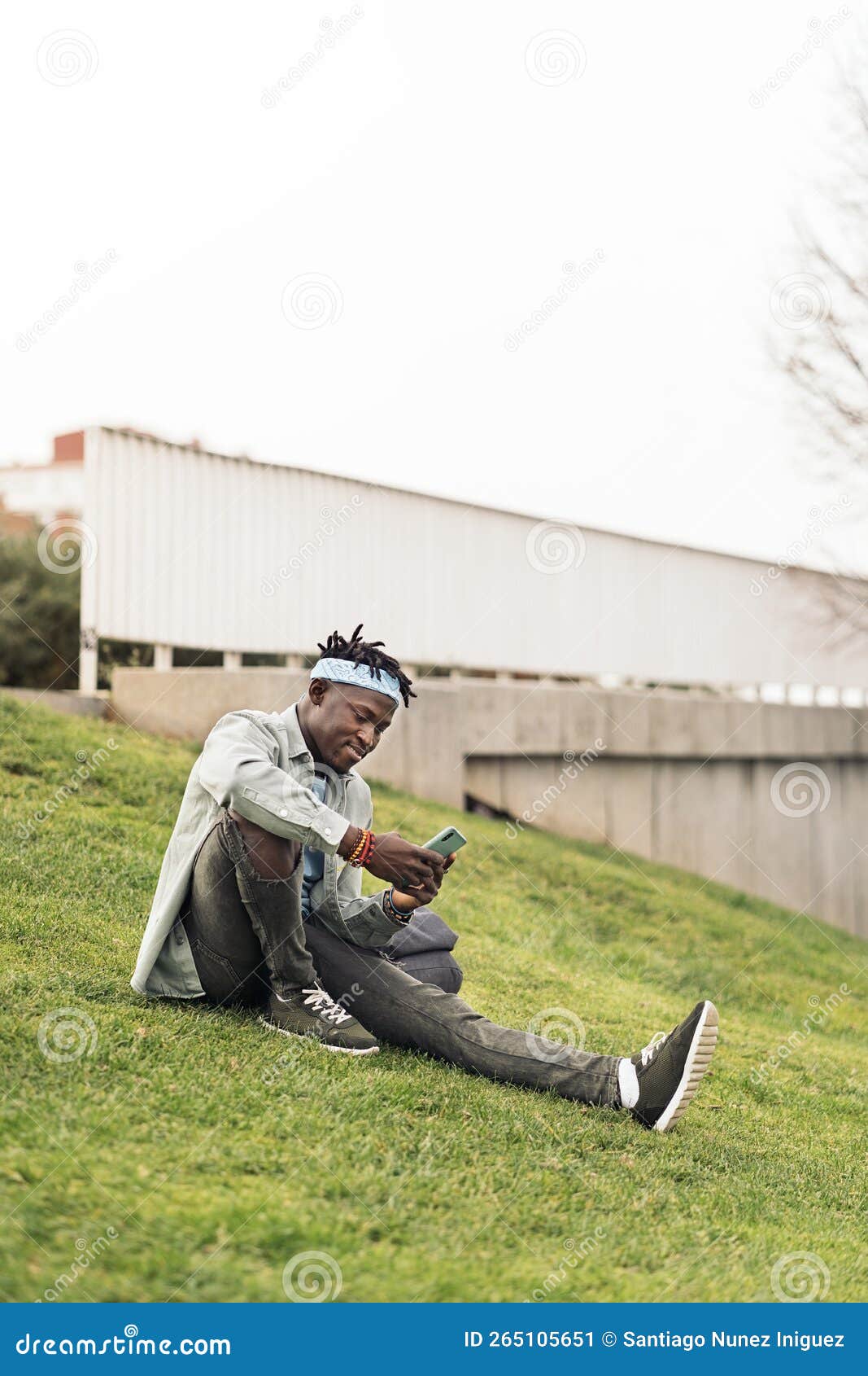 Black Boy Using Phone stock image. Image of handsome - 265105651