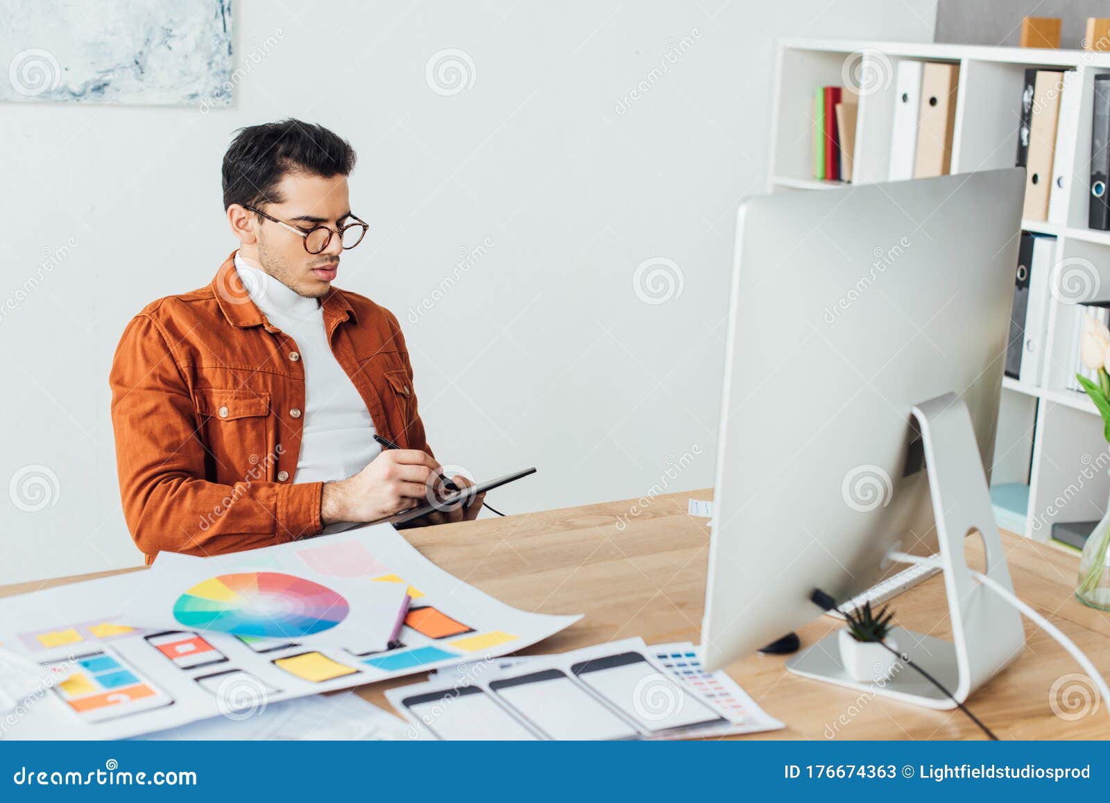 Handsome Creative Designer Using Graphics Tablet Near Computer and ...