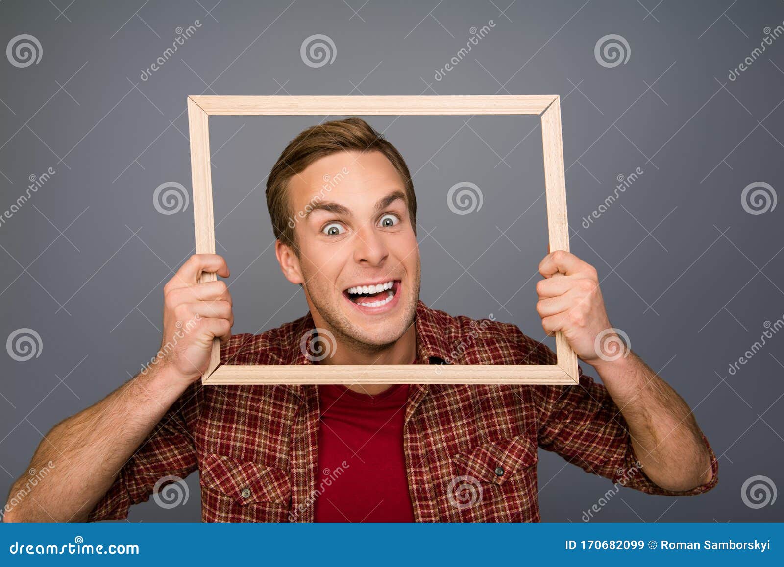 Handsome Creative Man Grimacing Inside Frame Stock Image - Image of ...