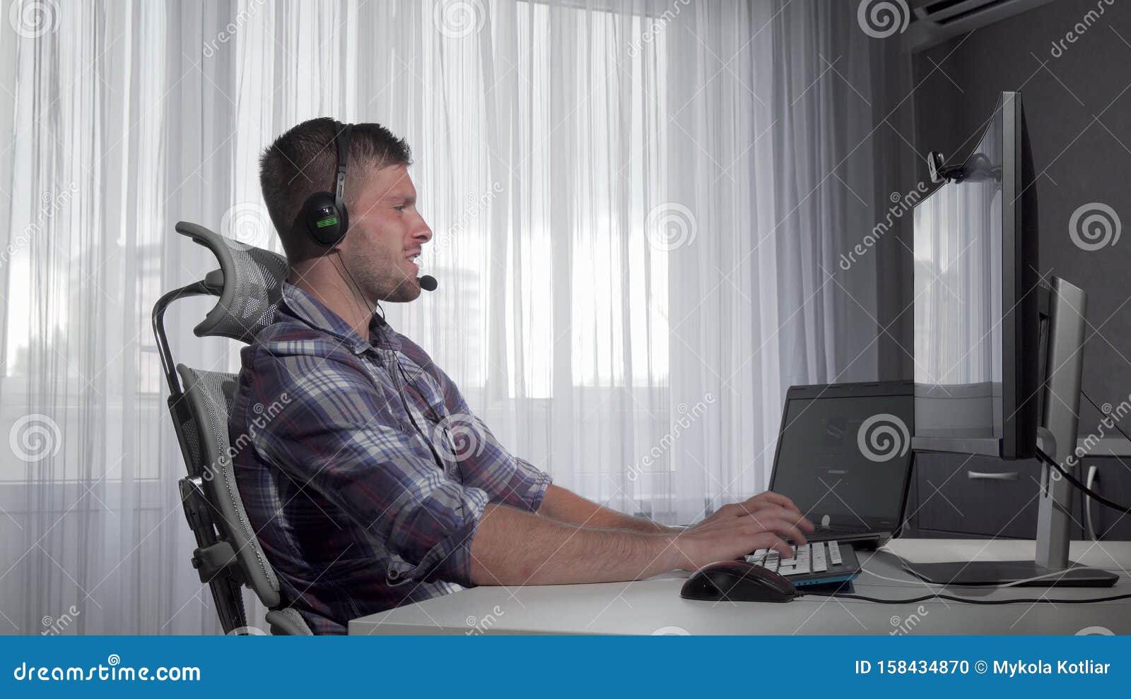 Handsome Customer Support Operator Typing on a Computer Stock Photo ...