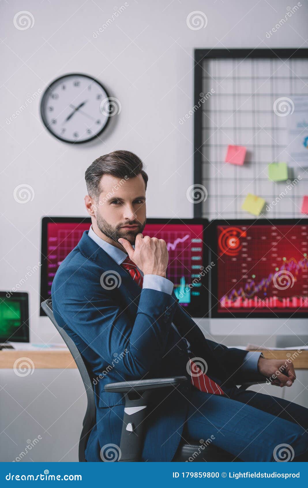 Handsome Data Analyst Looking at Camera Near Charts on Computer ...