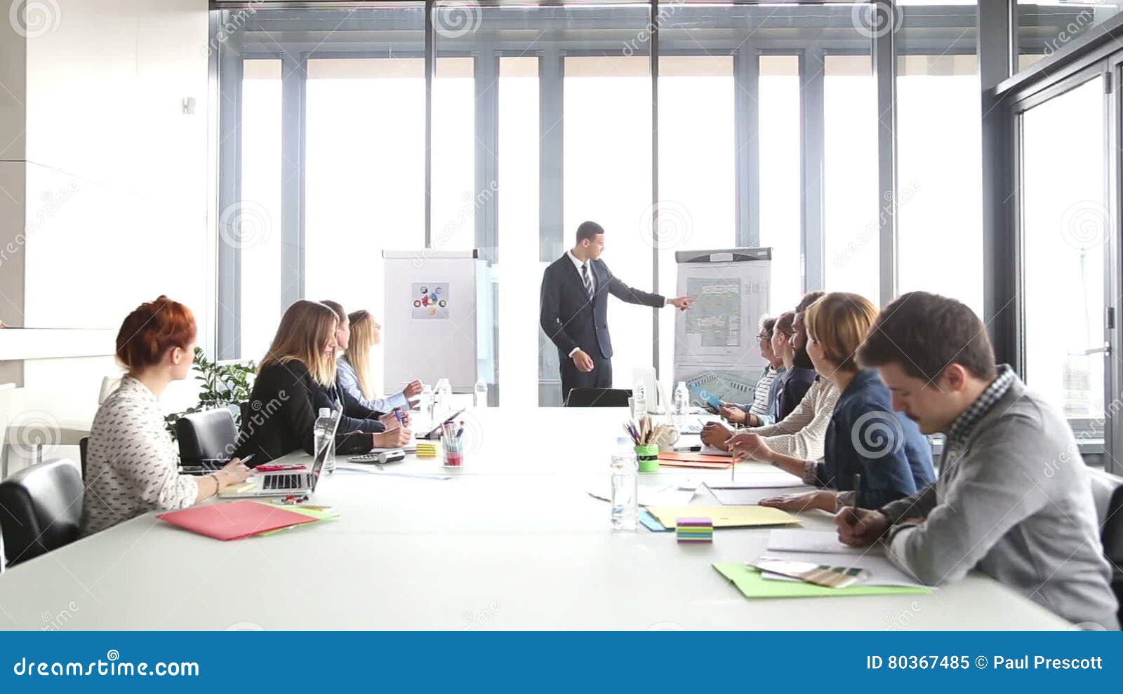 Handsome Director Pointing at Flipchart during a Meeting Stock Video ...