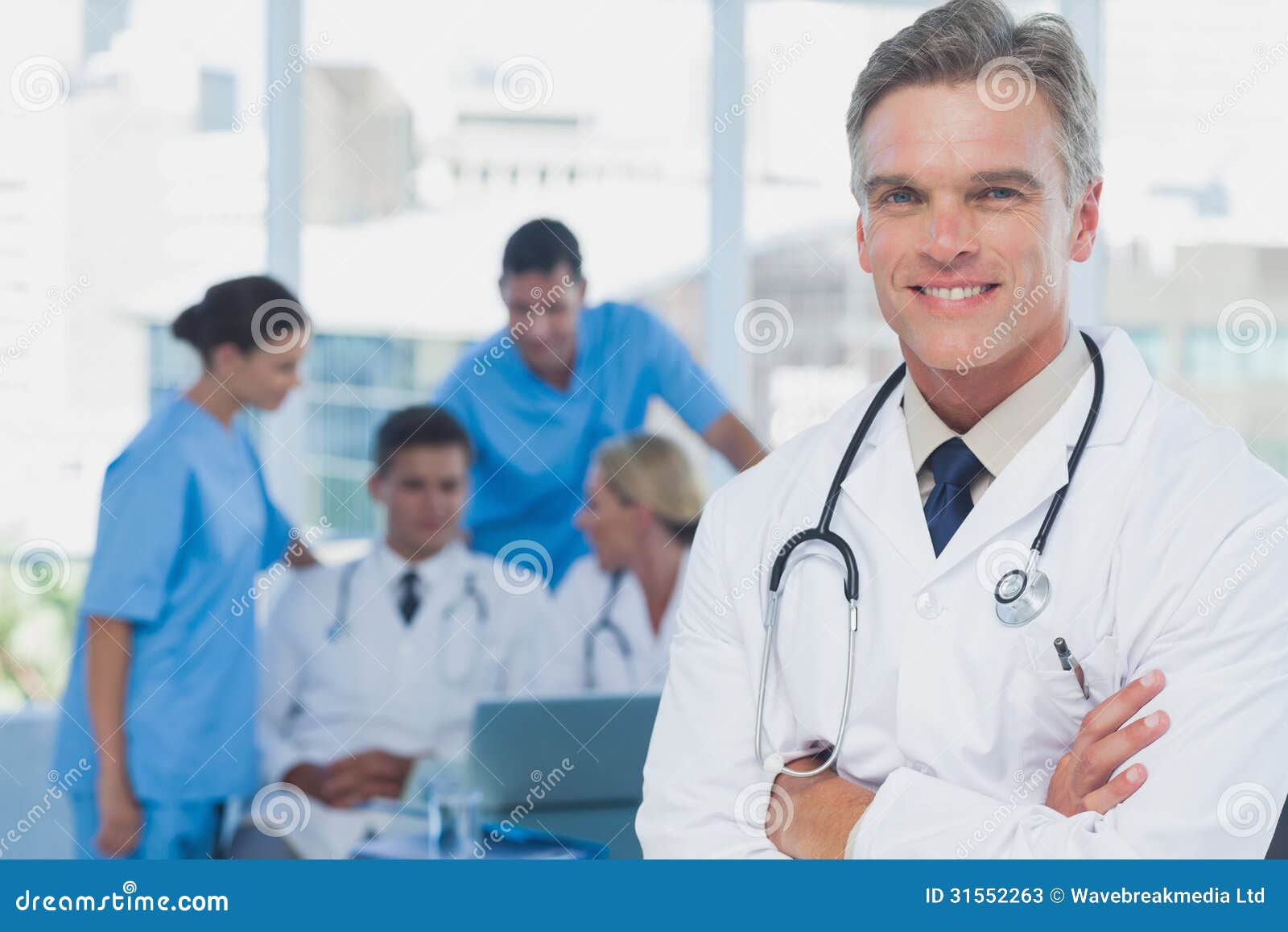 Handsome Doctor with Arms Folded Stock Image - Image of male, meeting ...
