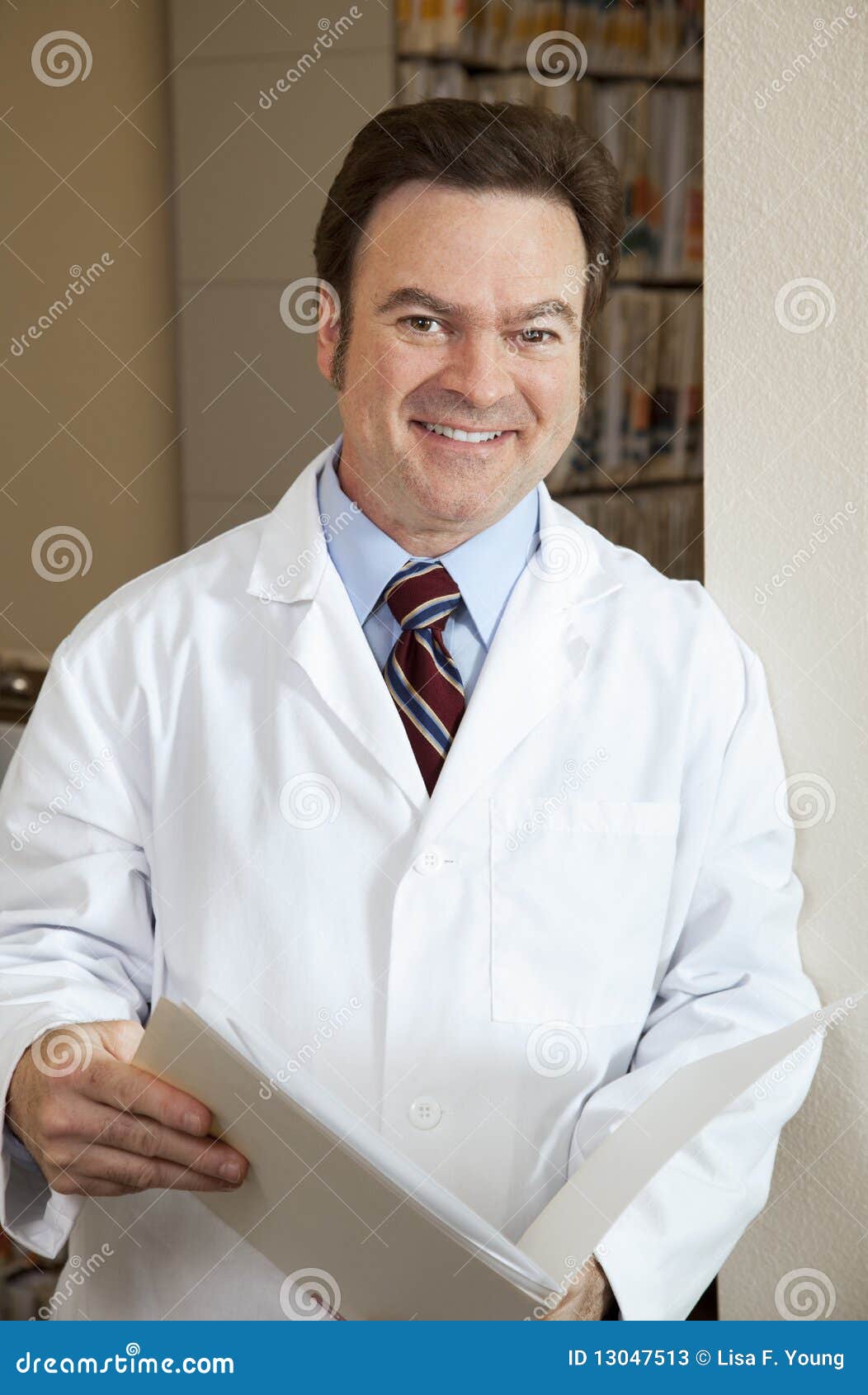 Handsome Doctor with Chart stock image. Image of office - 13047513