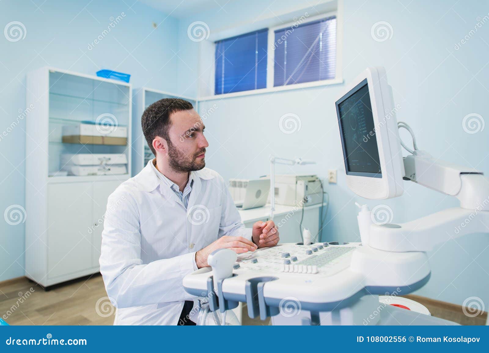 Handsome Doctor Using an Ultrasound Machine Stock Photo - Image of ...