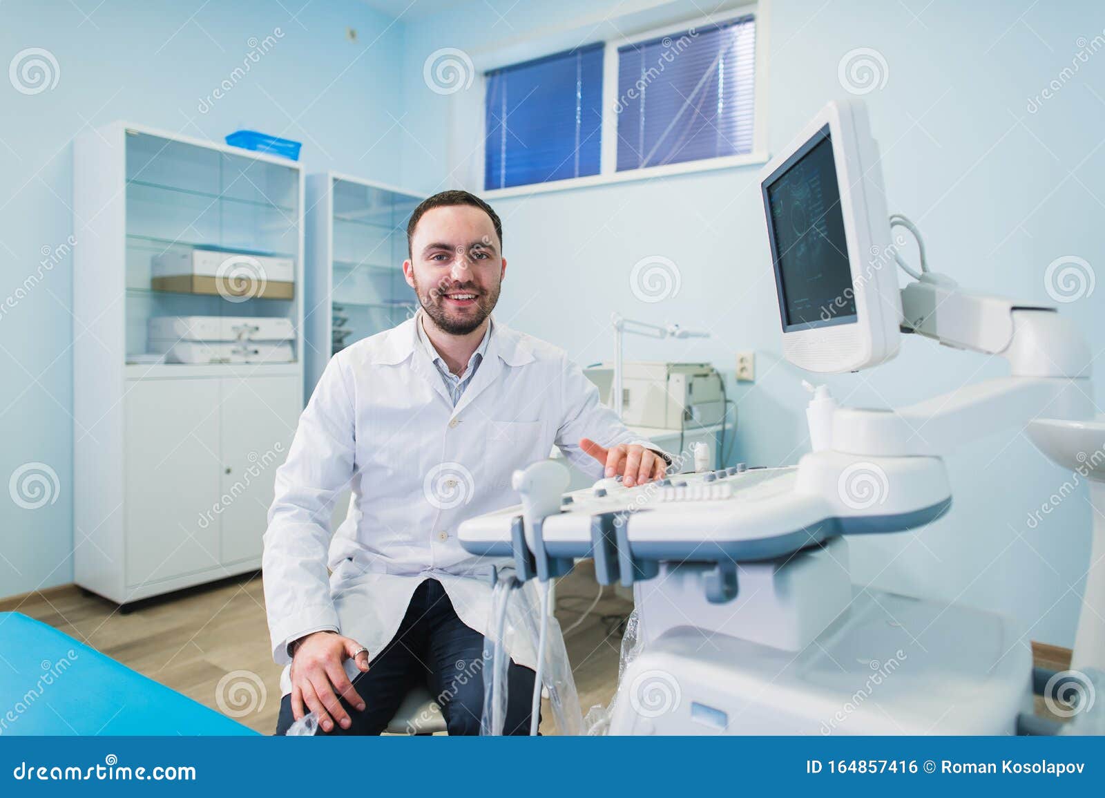 Handsome Doctor Using an Ultrasound Machine Stock Photo - Image of ...